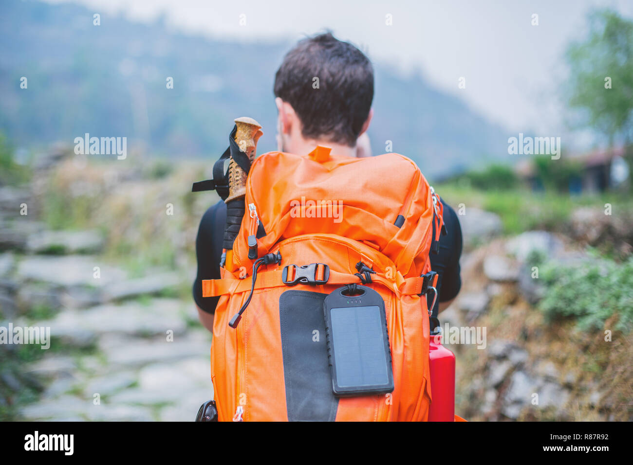 Trekker backpack with solar panel, rear view Stock Photo - Alamy