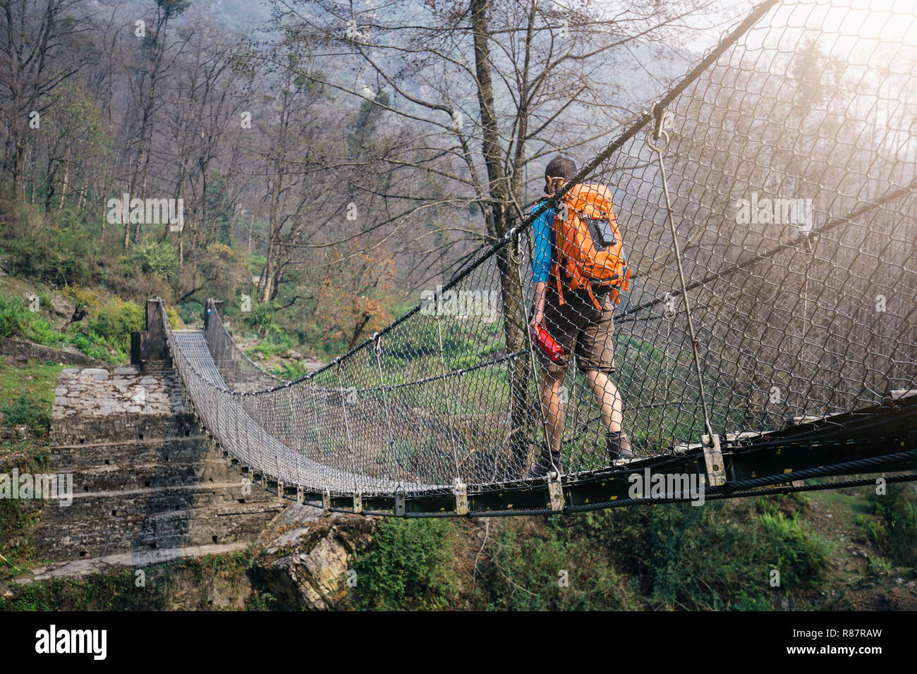 Person crossing bridge canyon hi-res stock photography and images - Alamy