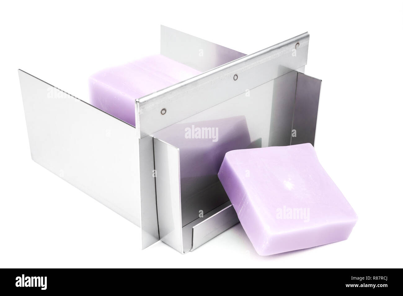 Stainless steel soap cutting tool with handmade soap loaf inside on the ...