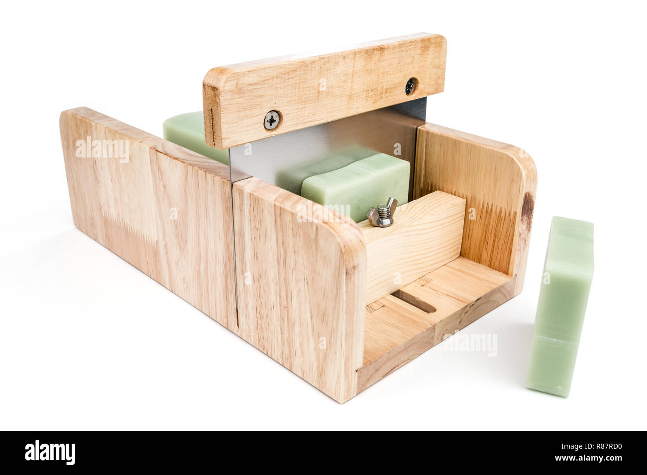 Wooden soap cutting tool with handmade soap loaf inside and bar in the ...