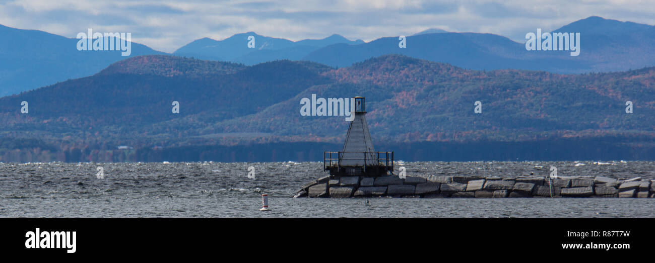 banner and panorama of lighthouse and breakwater on Lake Champlain in ...