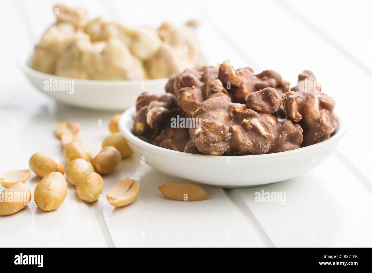 Peanuts covered chocolate. Tasty sweet chocolate truffles Stock Photo ...