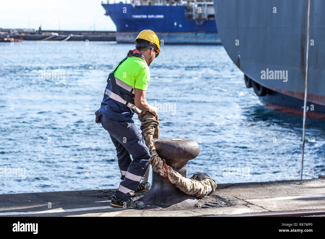worker unmooring a vessel Stock Photo - Alamy