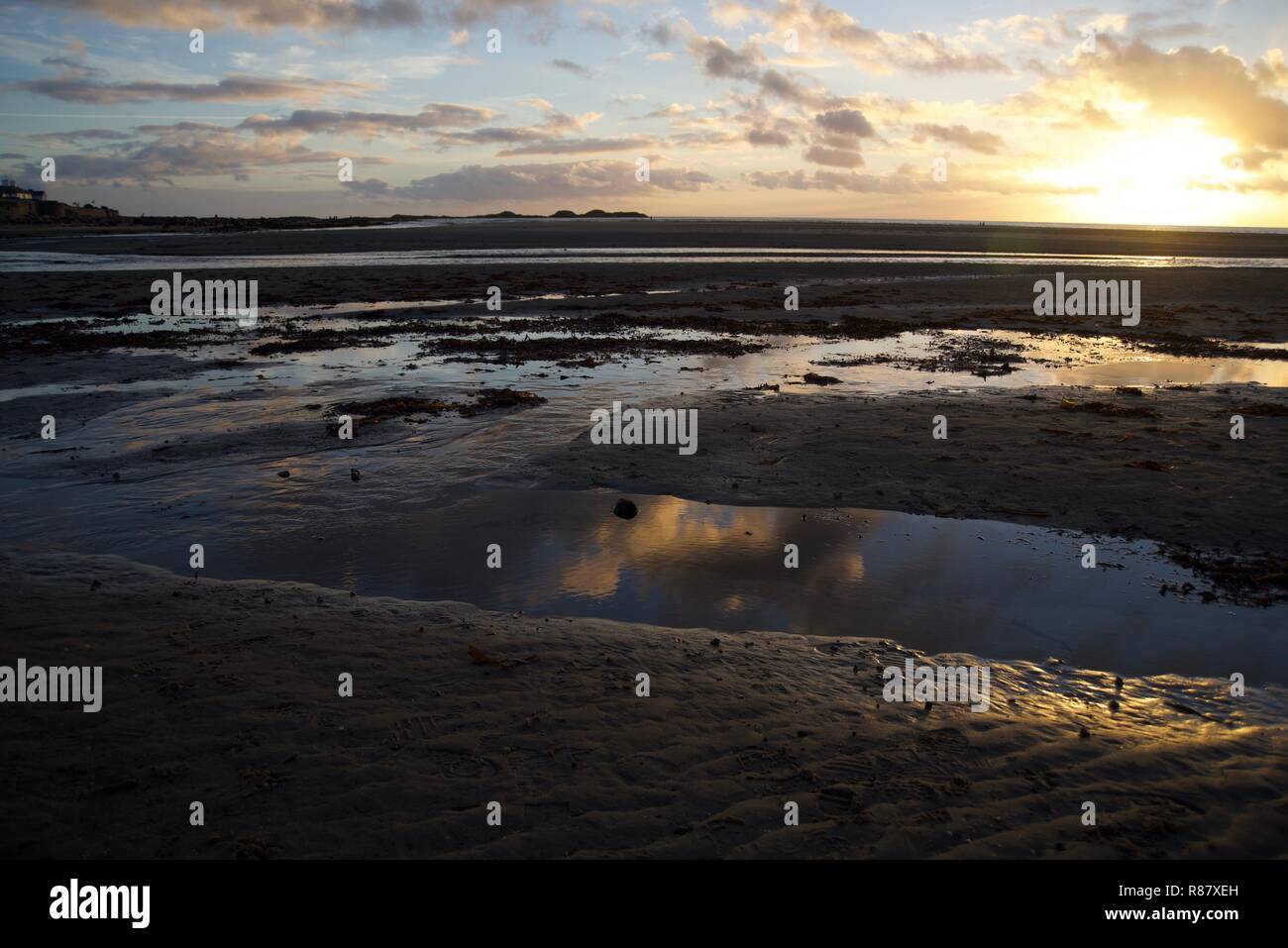 Sunset on the main beach in the village of Rhosneigr, Anglesey, North ...