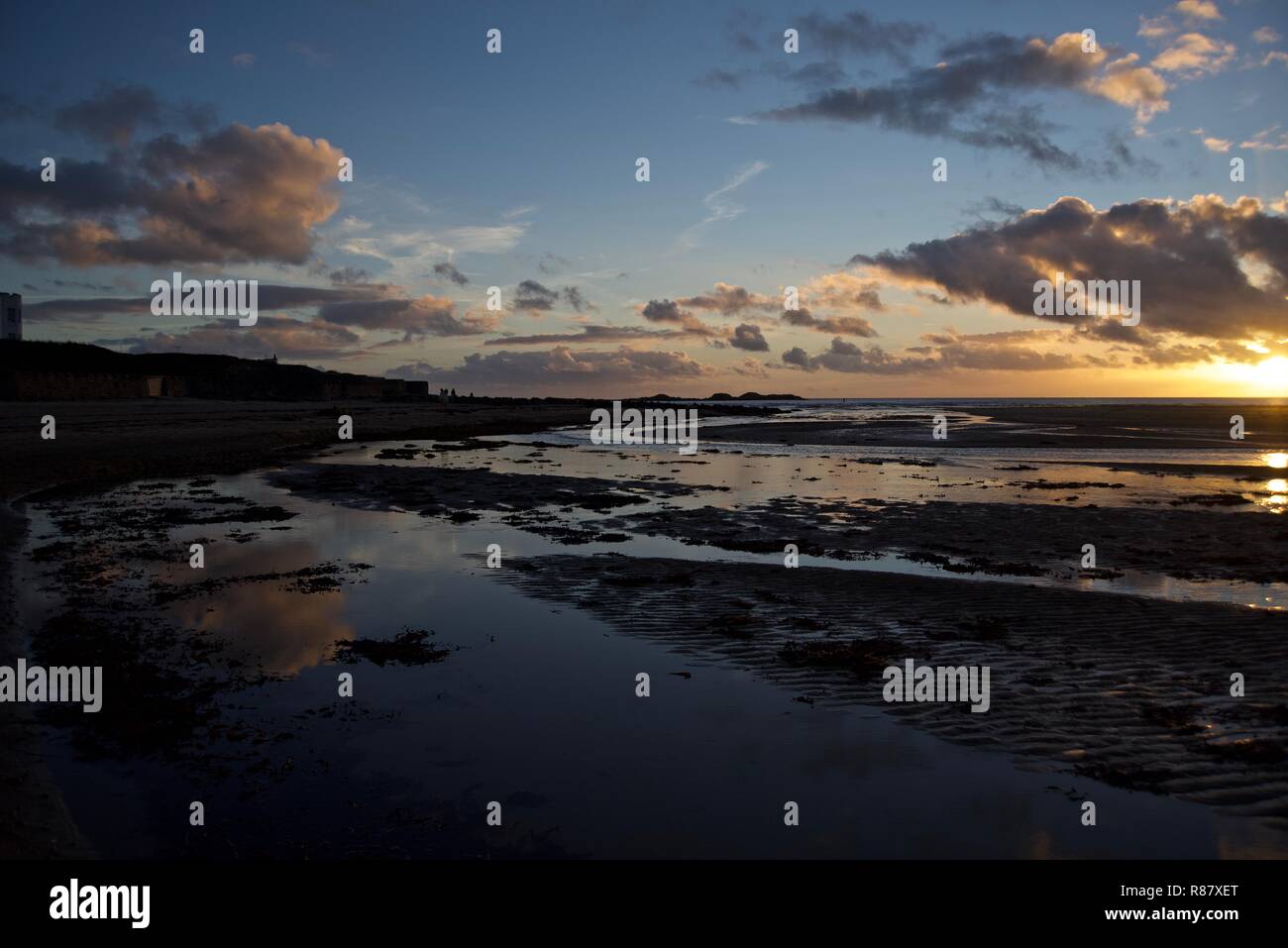 Sunset on the main beach in the village of Rhosneigr, Anglesey, North ...