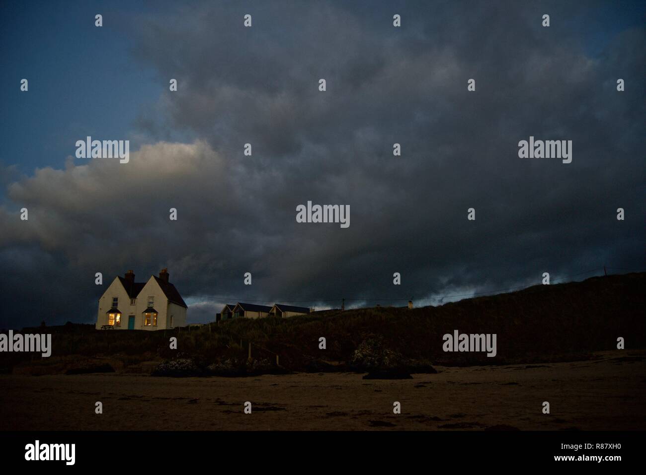 A beachfront victorian house at night in the seaside village of ...