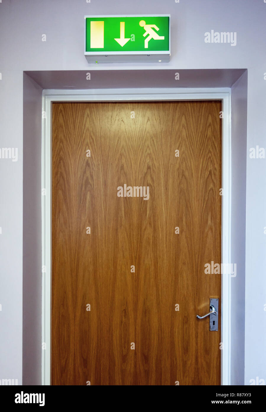 Green running man fire exit sign hi-res stock photography and images ...