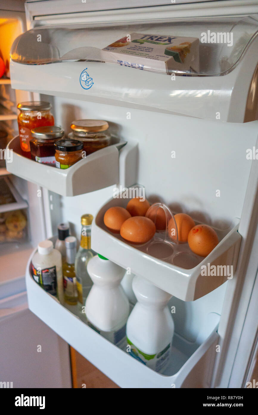 The inside shelves of a Fridge Door and the contents that are owned by ...