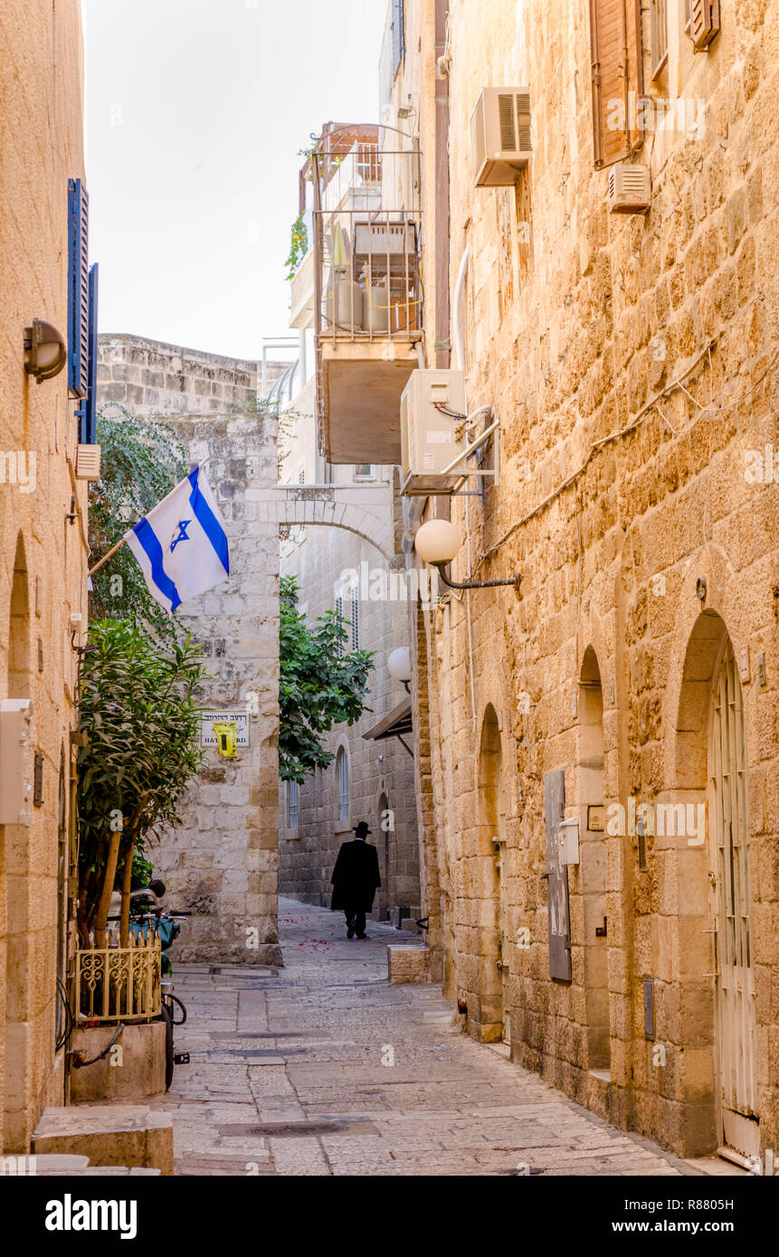 Ultra Orthodox Jewish man walking down a road in the Jewish Quarter of ...