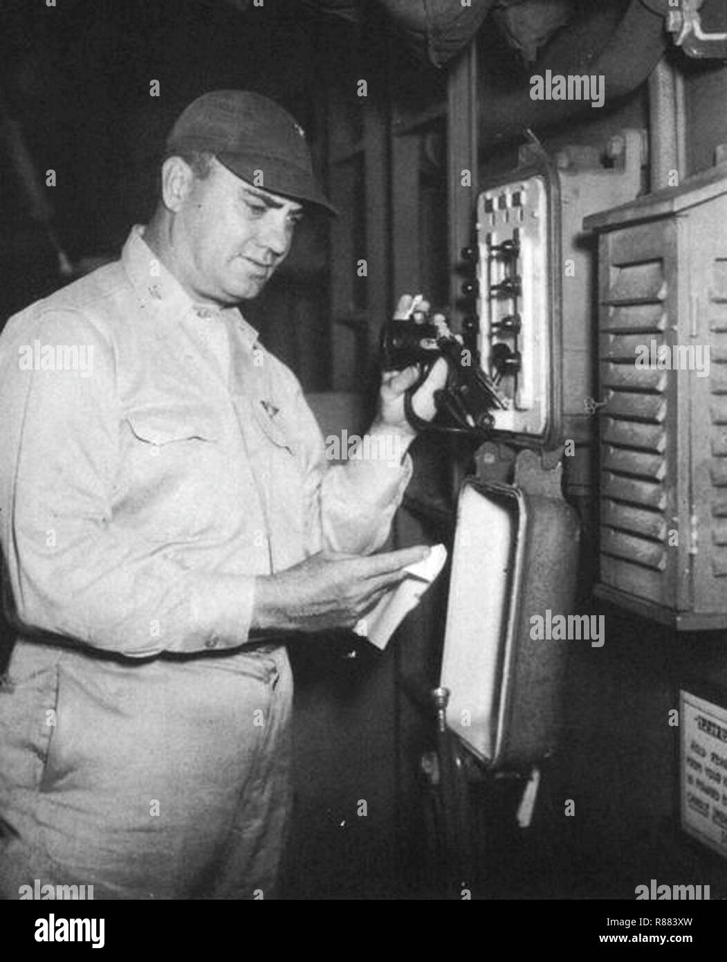 Captain Jackson R. Tate, USN, announces the surrender of Japan aboard ...