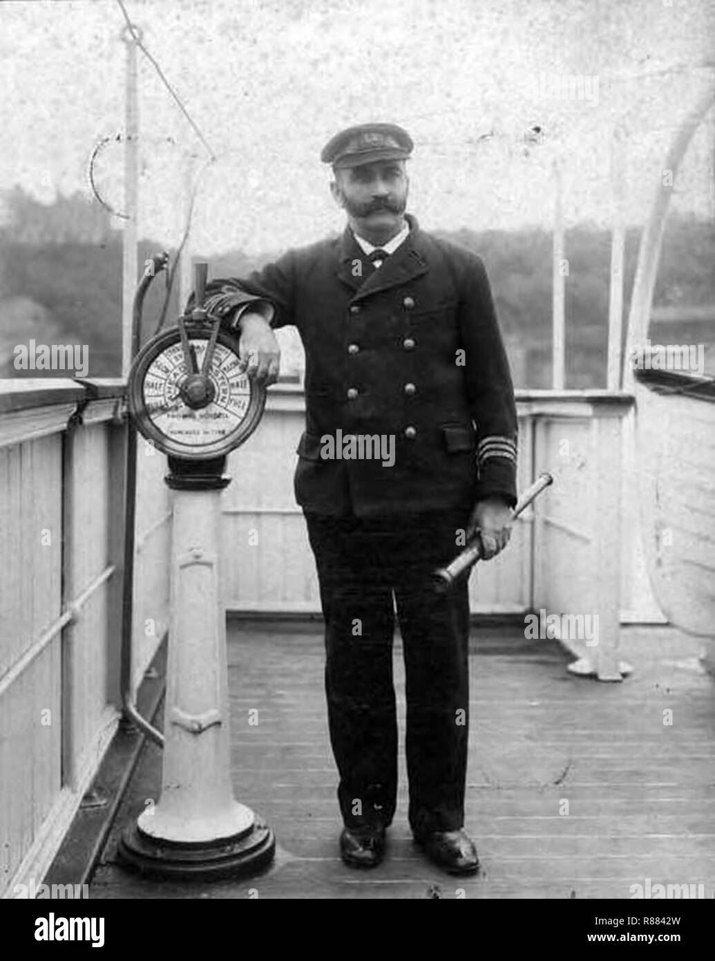 Captain of British sailing vessel ASKEHALL standing by ship's telegraph ...