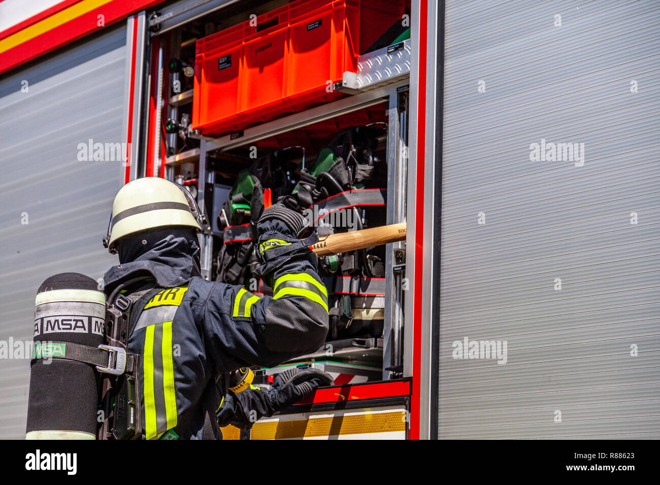 HANNOVER / GERMANY - JULY 6, 2017: German fireman takes an object from ...