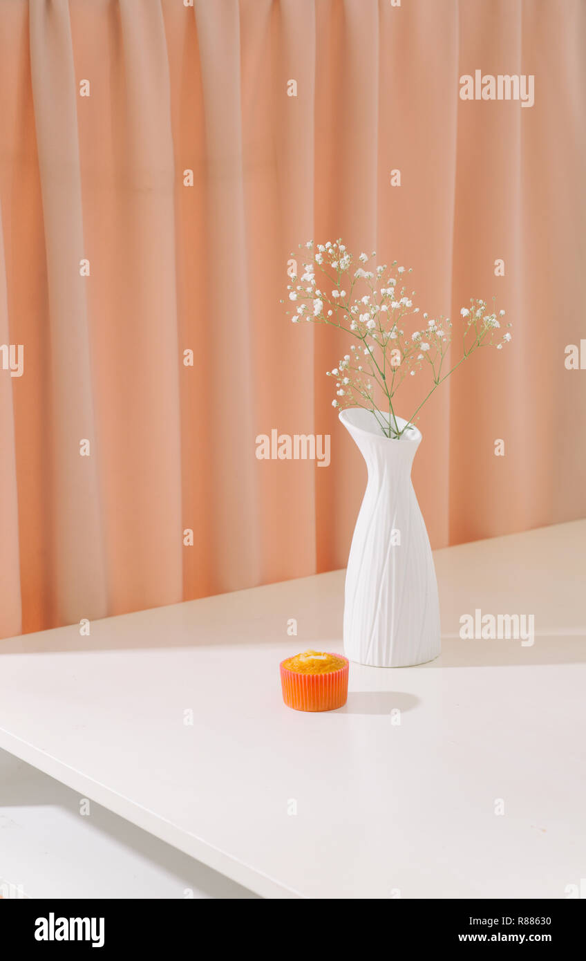 Gypsophila (Baby's breath flowers), in bottle on textured background ...