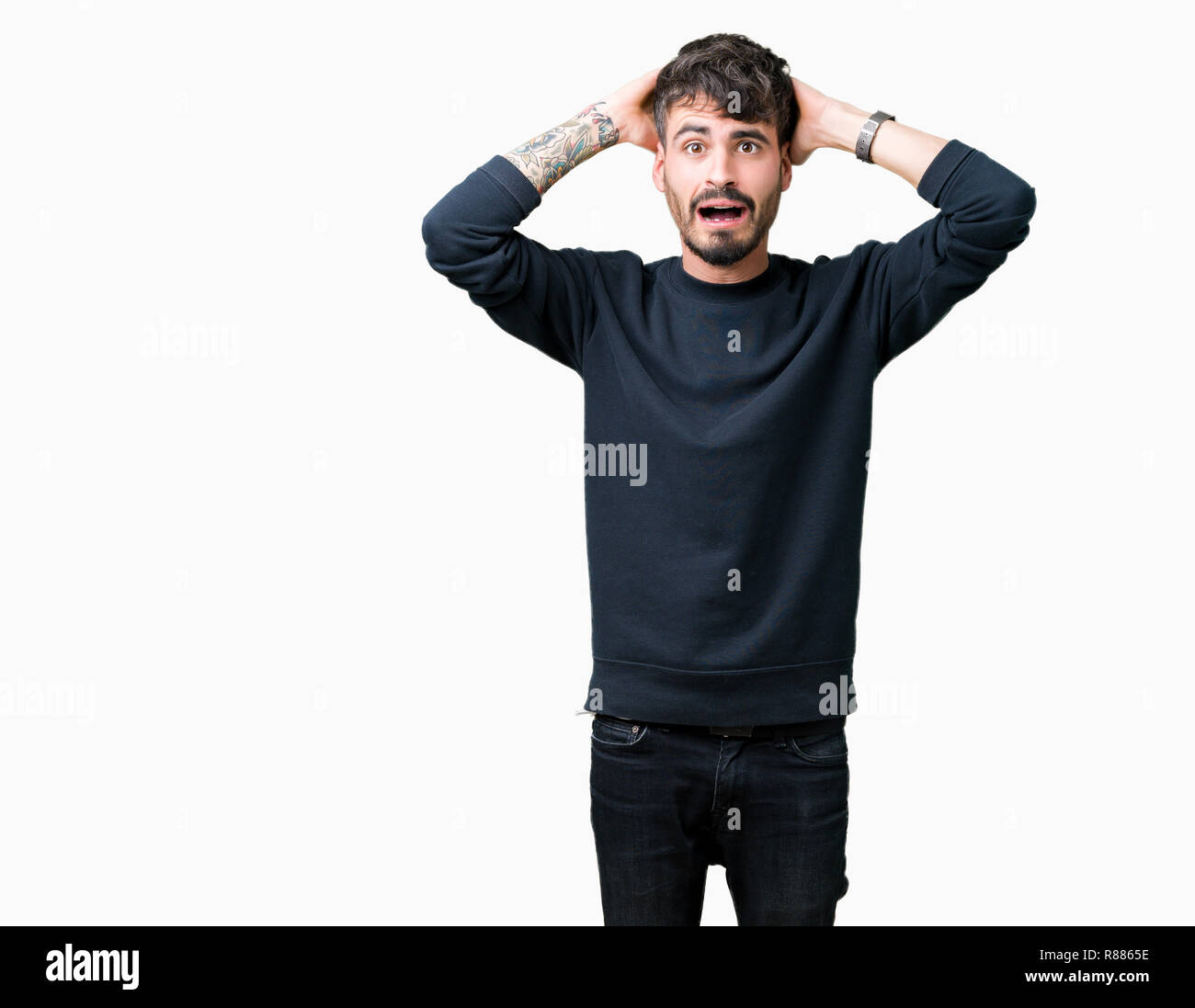Young handsome man over isolated background Crazy and scared with hands ...