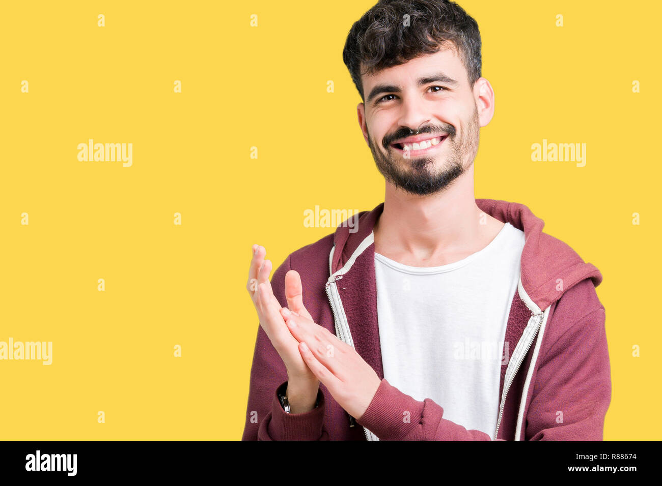 Young handsome man over isolated background Clapping and applauding ...