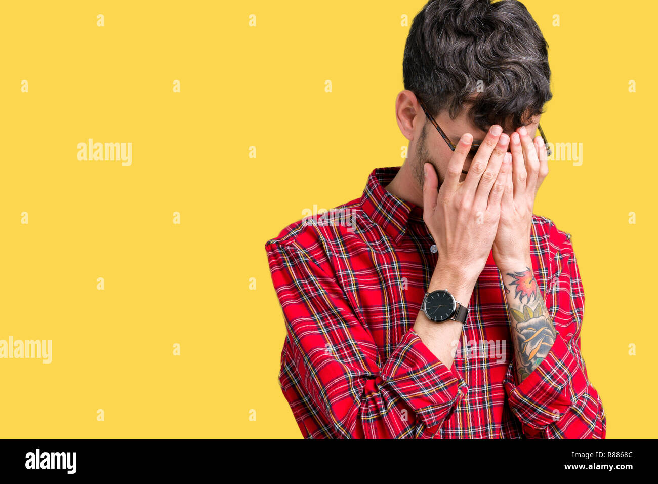 Young handsome man wearing glasses over isolated background with sad ...