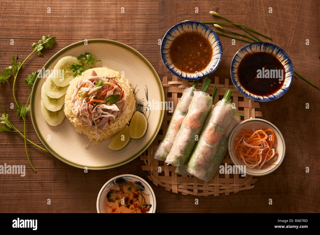 Assorted asian dinner, vietnamese food. Chicken rice, spring rolls ...