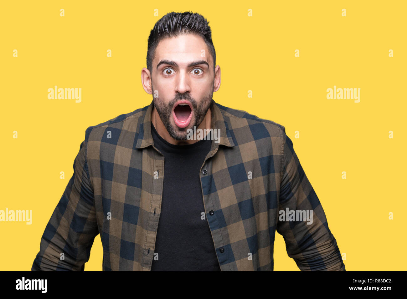 Young handsome man over isolated background afraid and shocked with ...