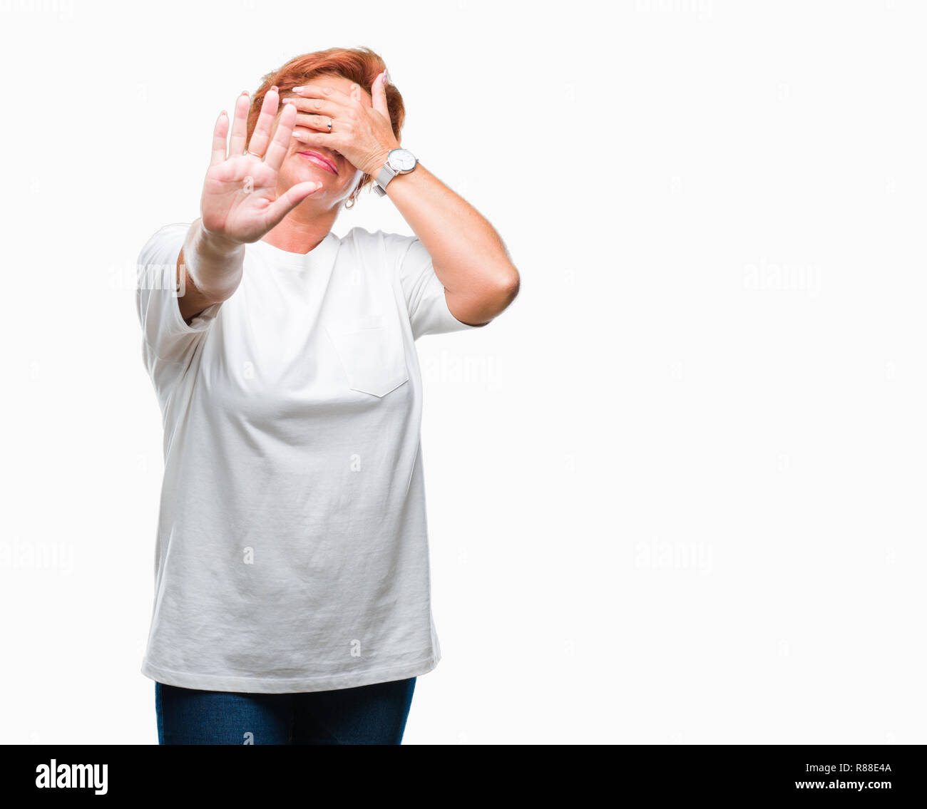 Senior woman cover eyes Cut Out Stock Images & Pictures - Alamy