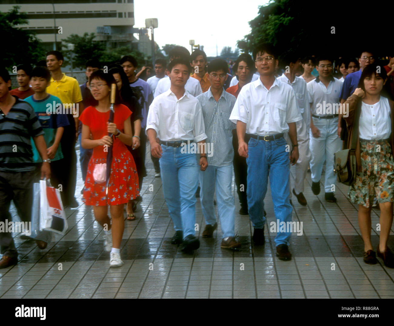 Crowds in Singapore men and women, 1990s Stock Photo - Alamy