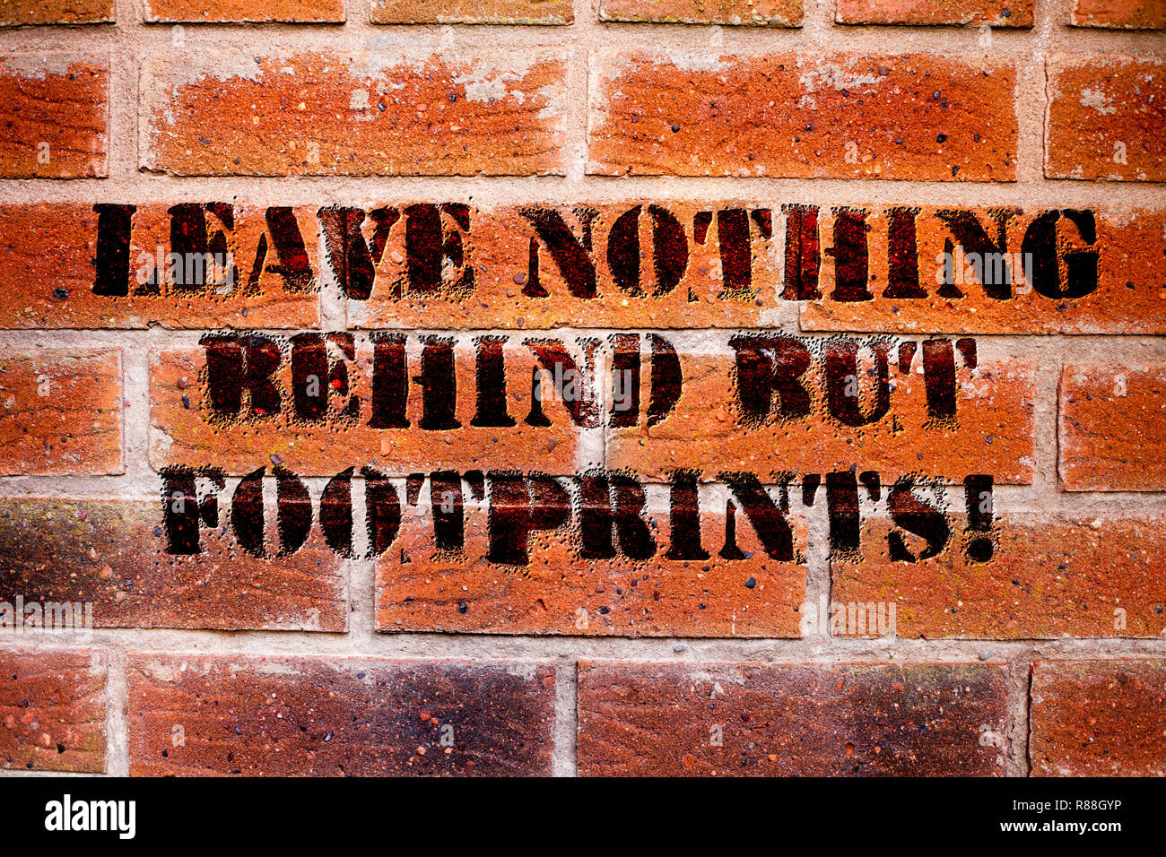 Conceptual hand writing showing Leave Nothing Behind But Footprints ...