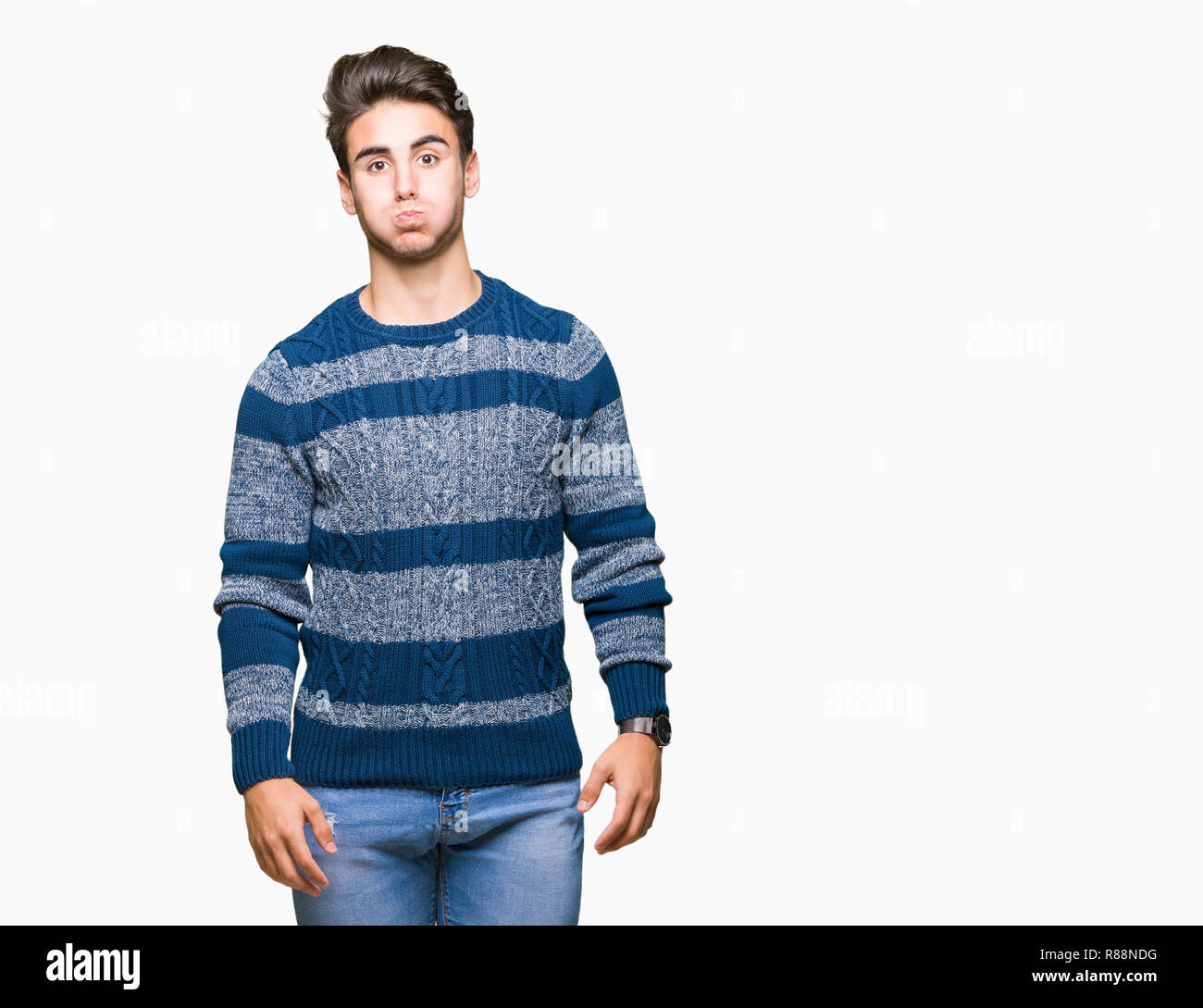 Young handsome man over isolated background puffing cheeks with funny ...