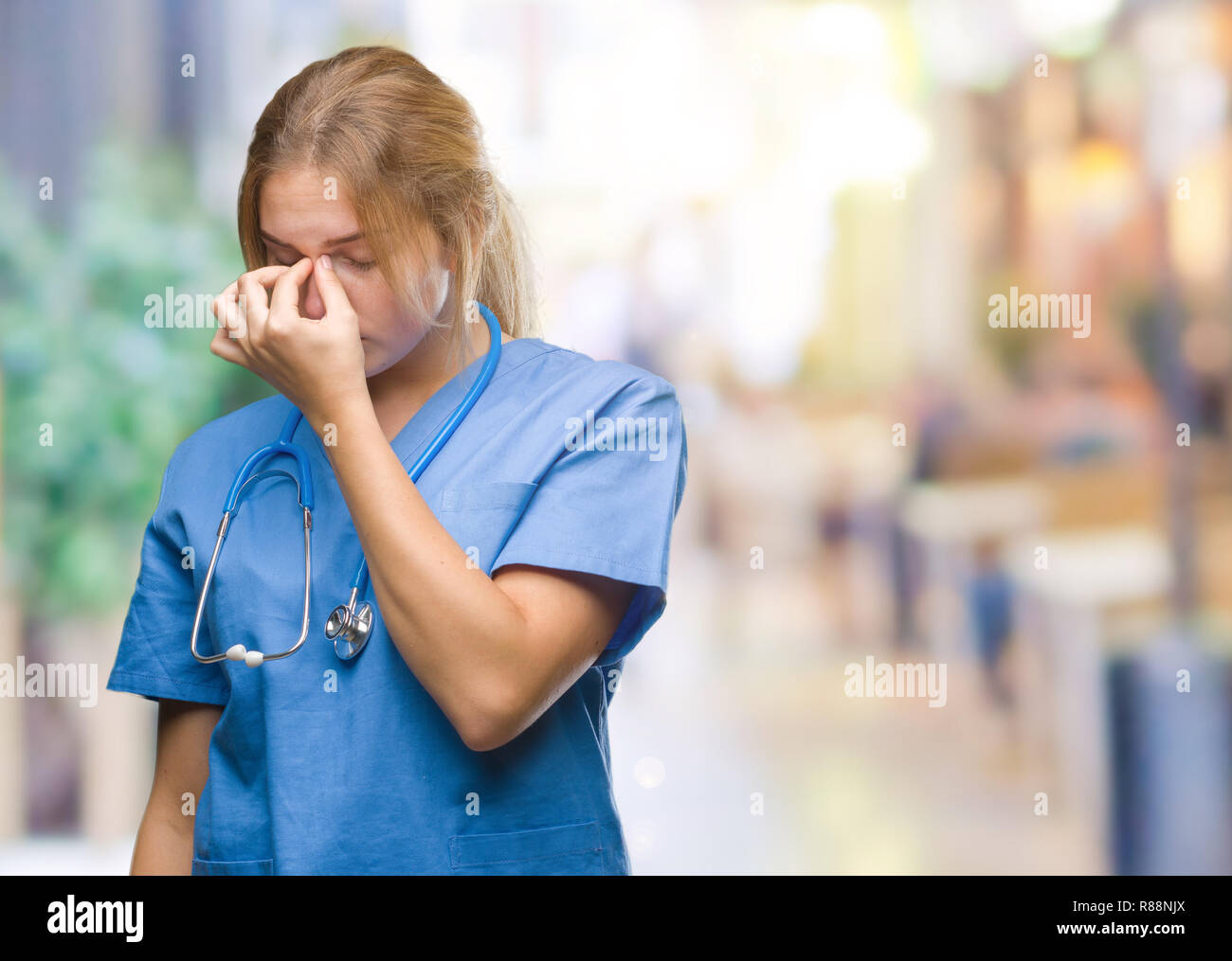 Young caucasian doctor woman wearing surgeon uniform over isolated ...