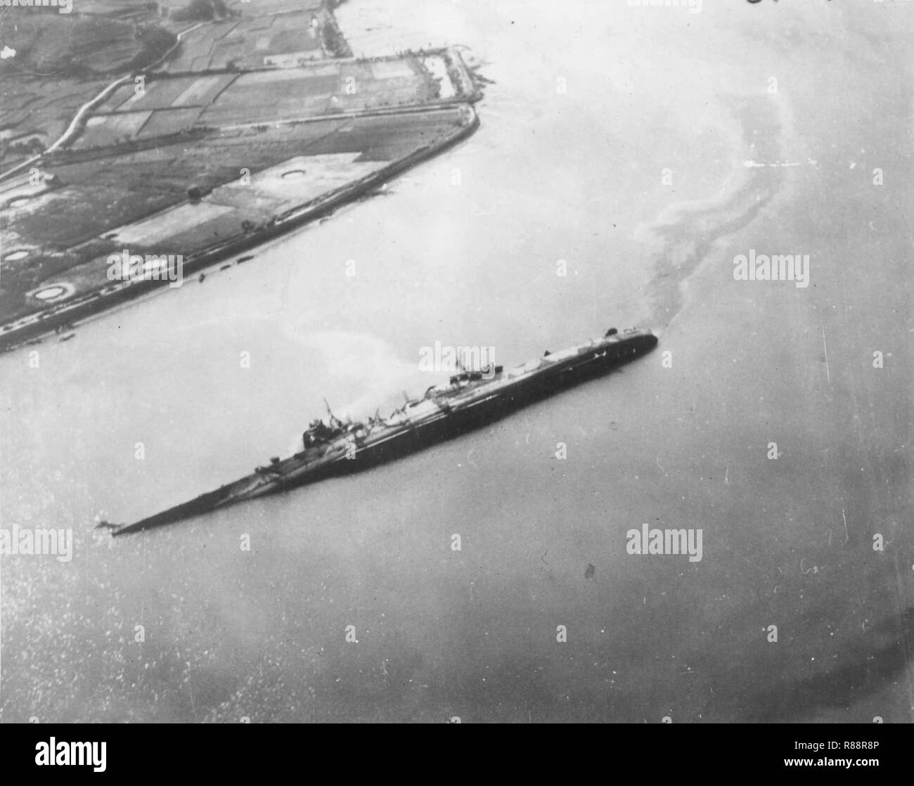Capsized Japanese cruiser Ōyodo at Kure, Japan, on 28 July 1945 (NNAM ...