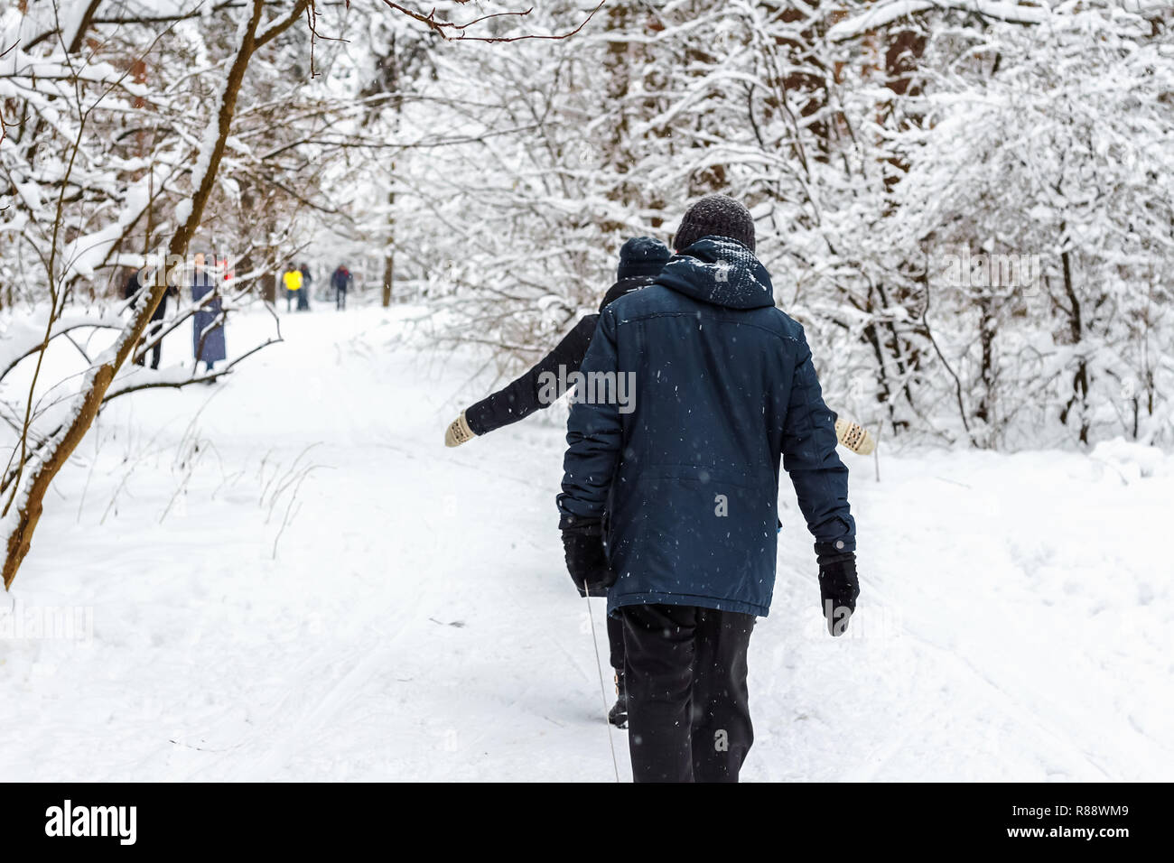 Walk man woman snow hi-res stock photography and images - Alamy