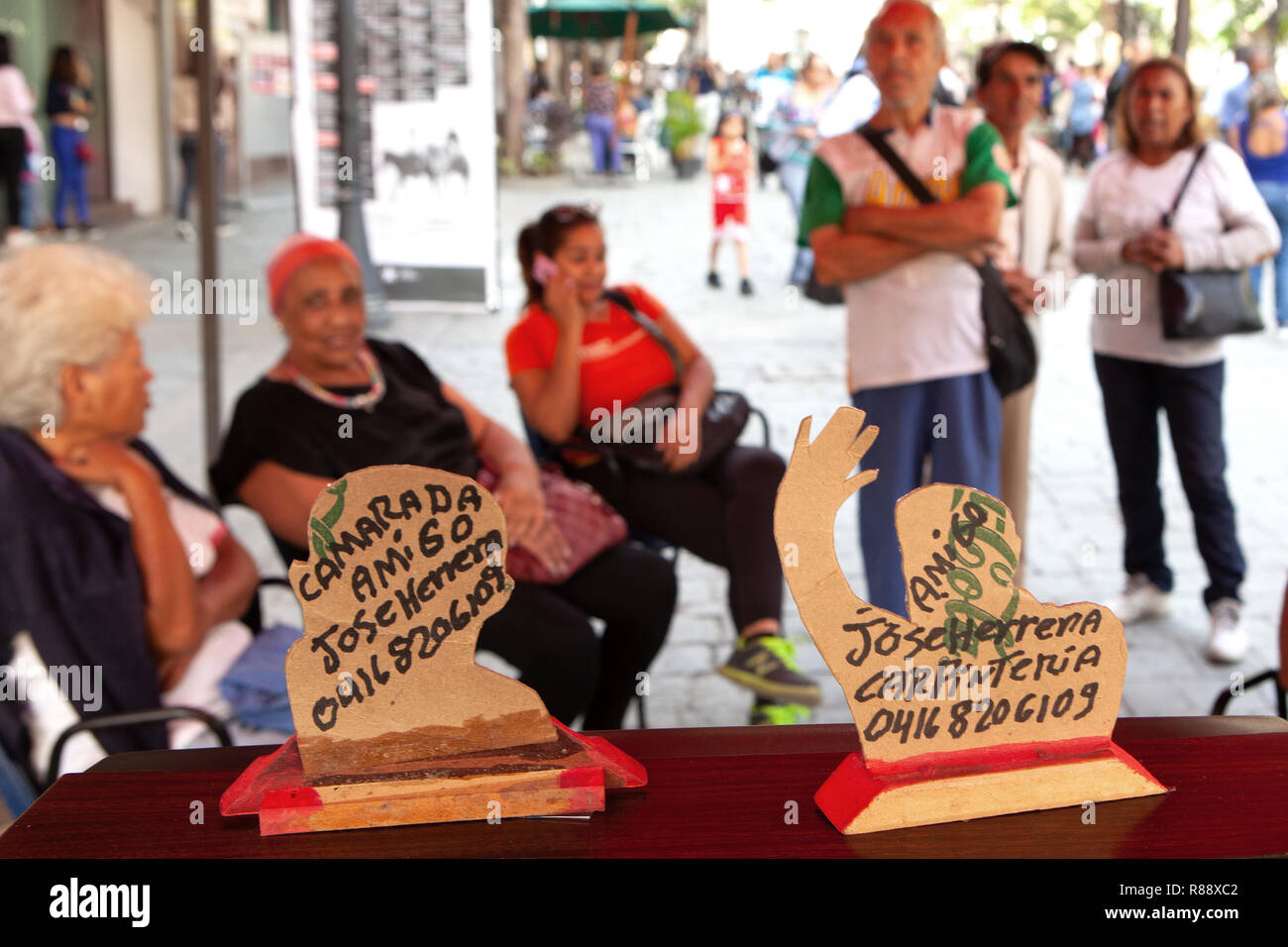 Street scene close up of head and shoulder cut outs with names and ...