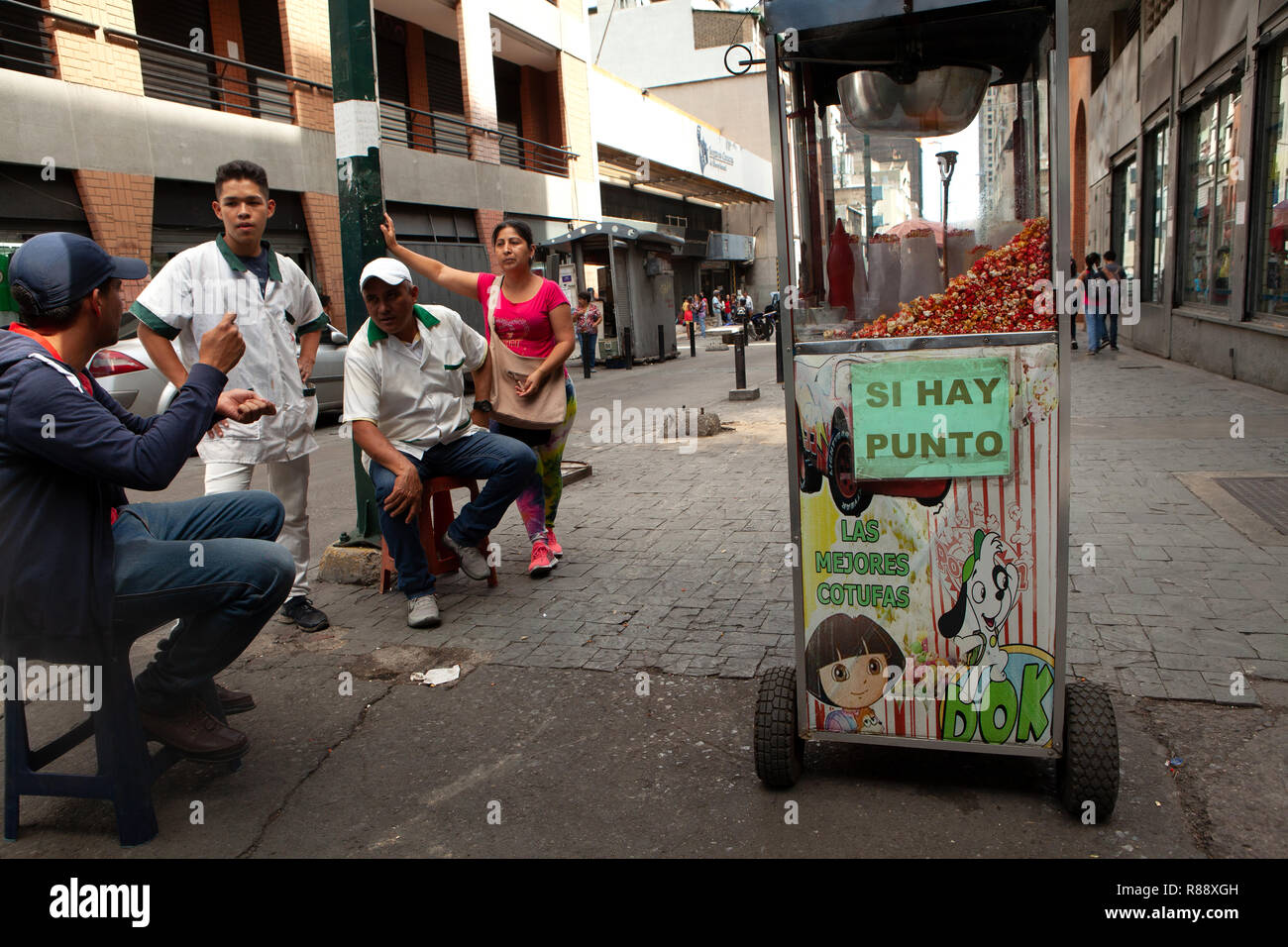 Street vendors talking on city street, street sceneCaracas, Venezuela ...