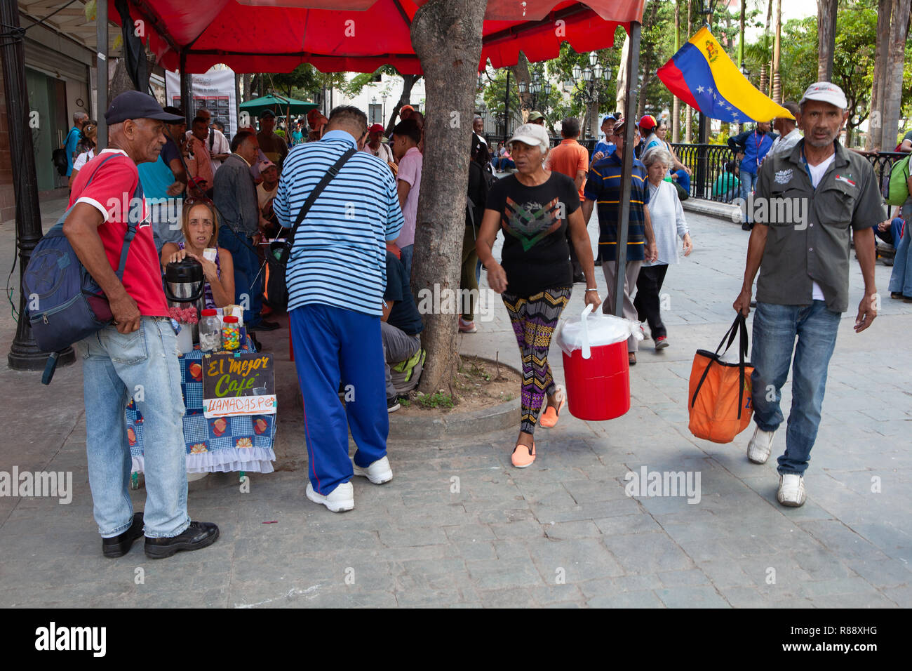 Woman street vendor selling refreshments, street scene, Caracas ...