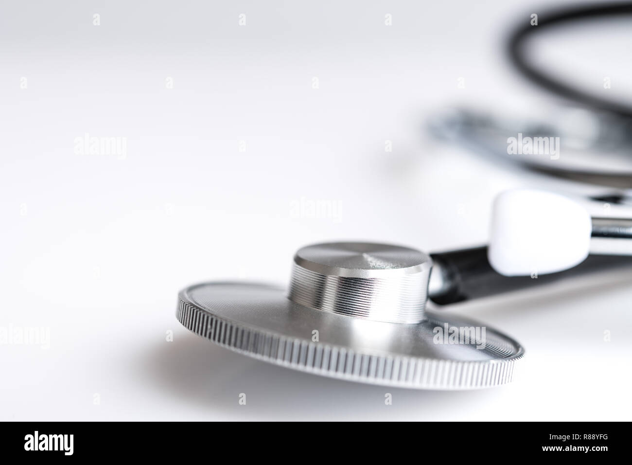 stethoscope on white table Stock Photo - Alamy