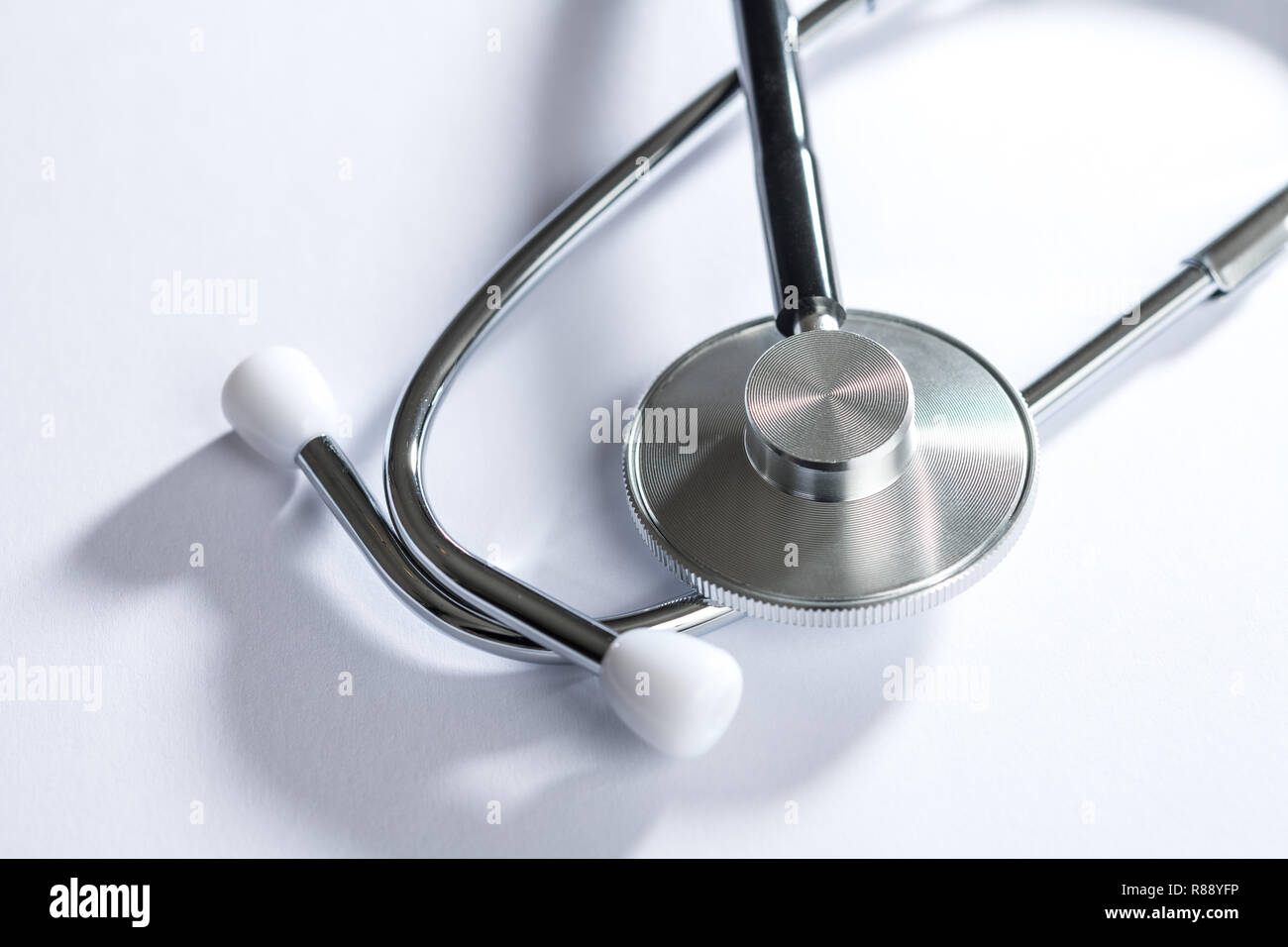 stethoscope on white table Stock Photo - Alamy