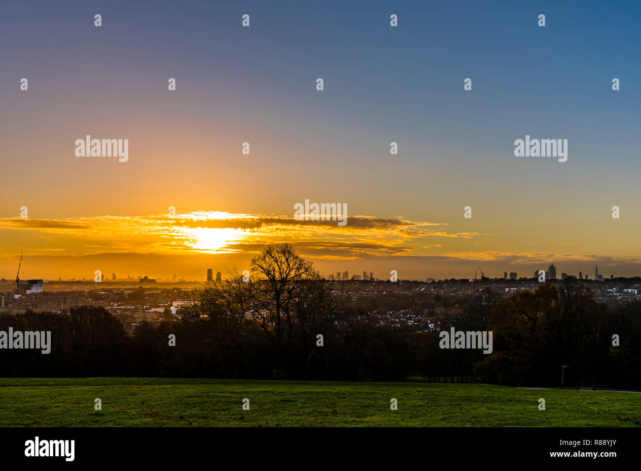 Sunrise over the London skyline from Alexandra Palace Park, London, UK ...