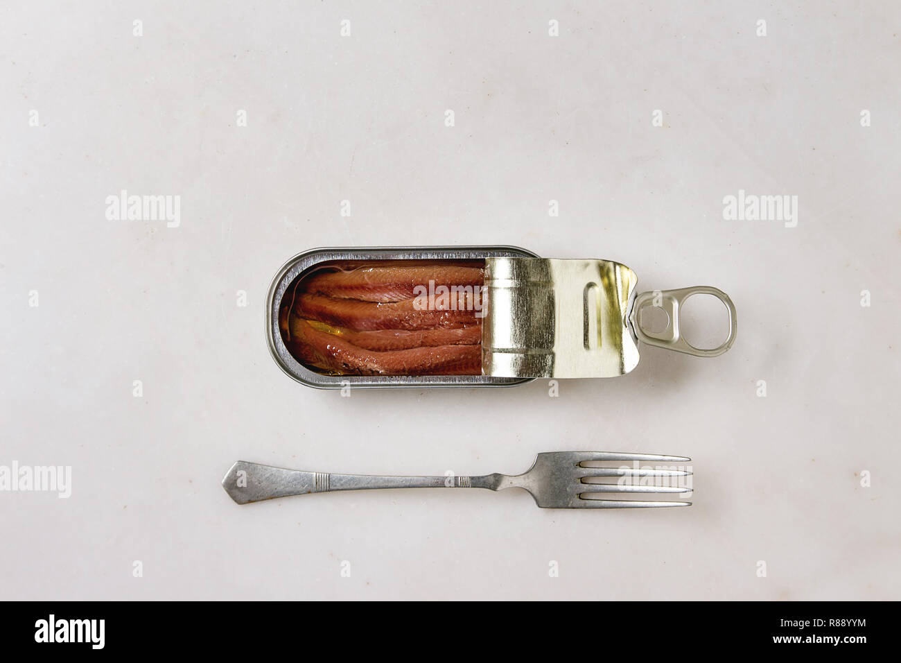 Pickled anchovies in tin can Stock Photo - Alamy