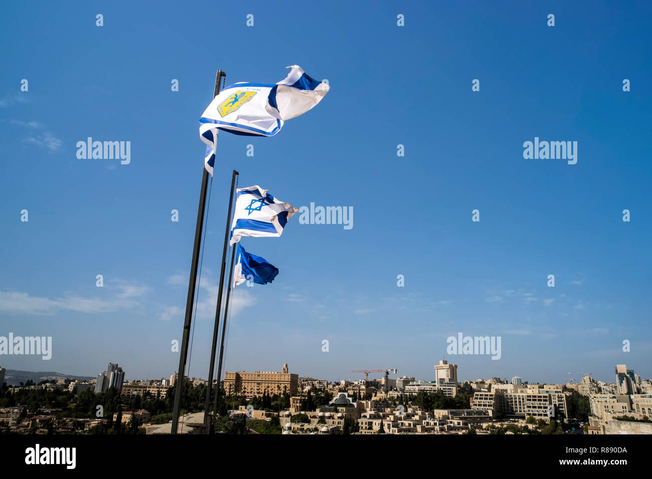 Israel and Jerusalem flags on Jerusalem old city walls against the blue ...