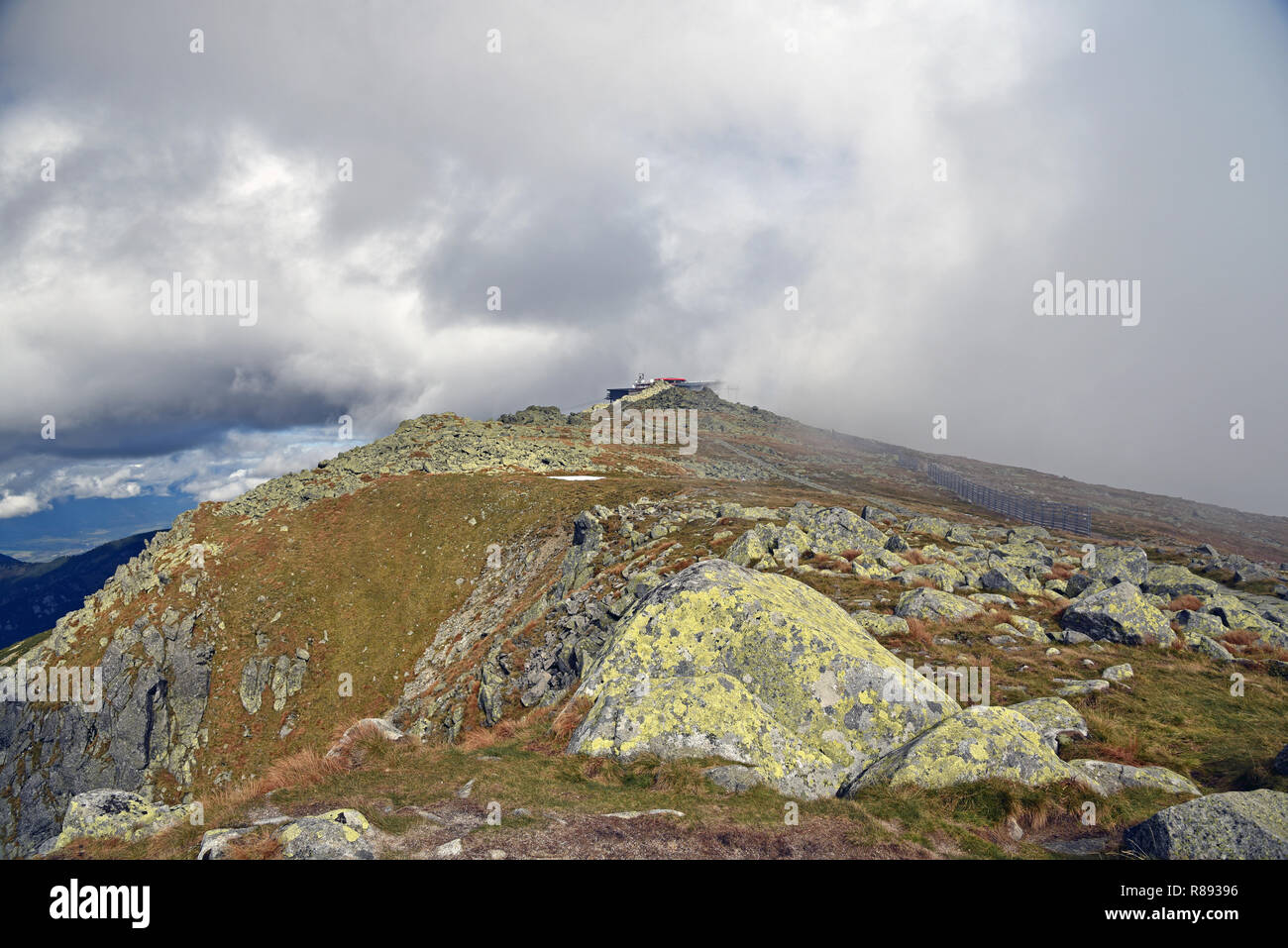 Chopok mountain peak with stones and meadow in Nizke Tatry mountains in ...