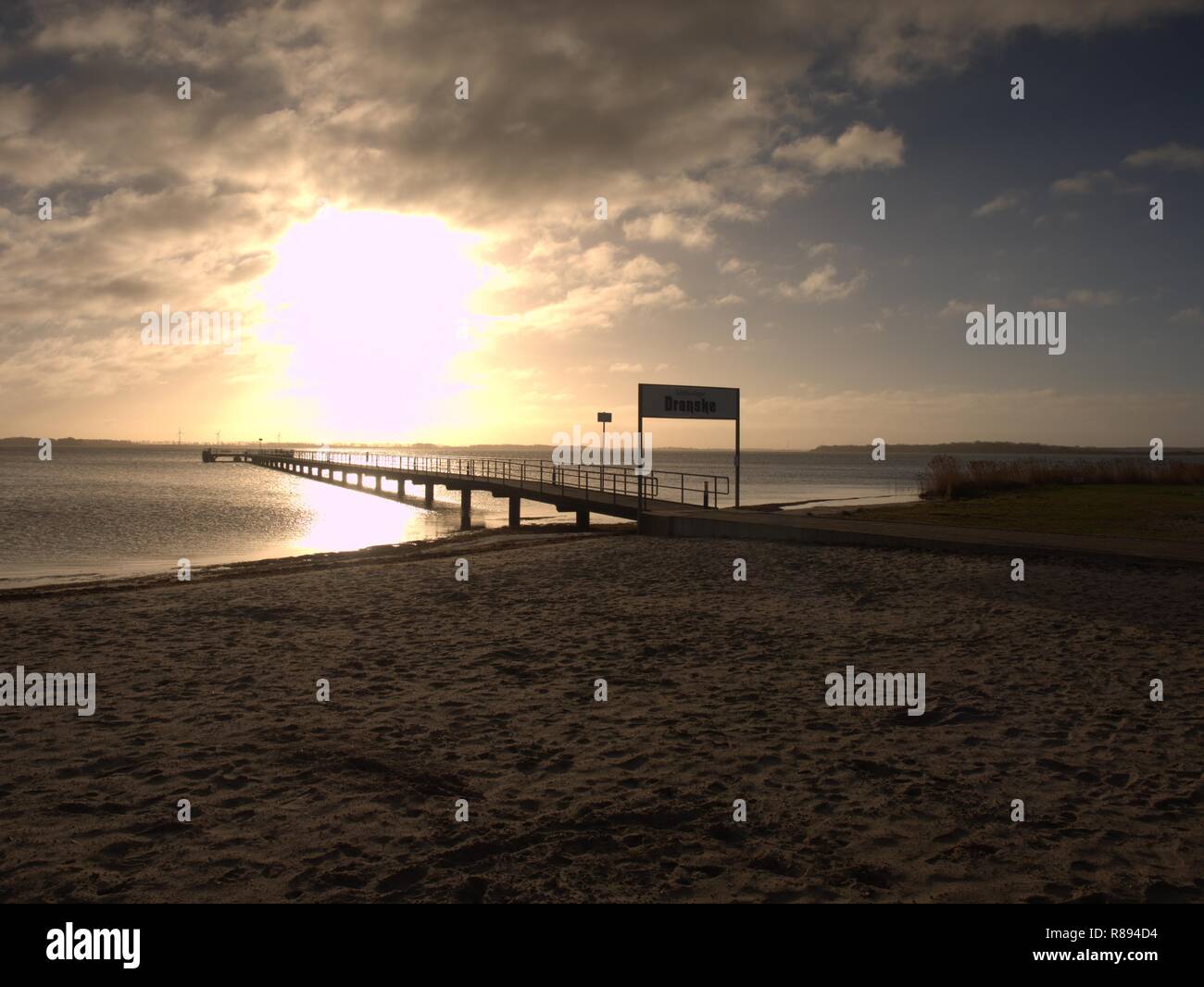 Pier at horizon goes into the misty sea. Depression dark atmosphere ...