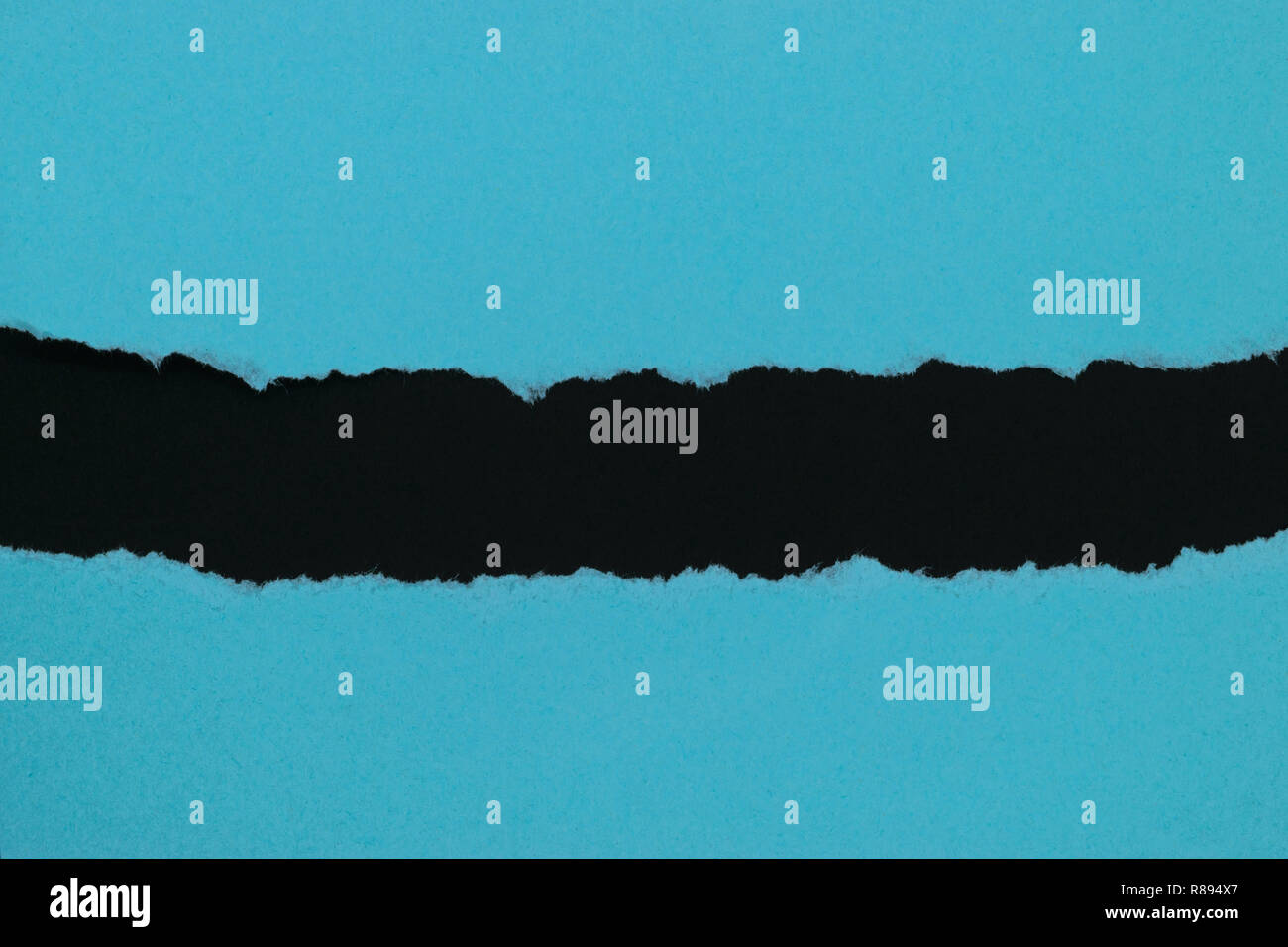 Blue ripped paper placed on black background paper with copy space ...