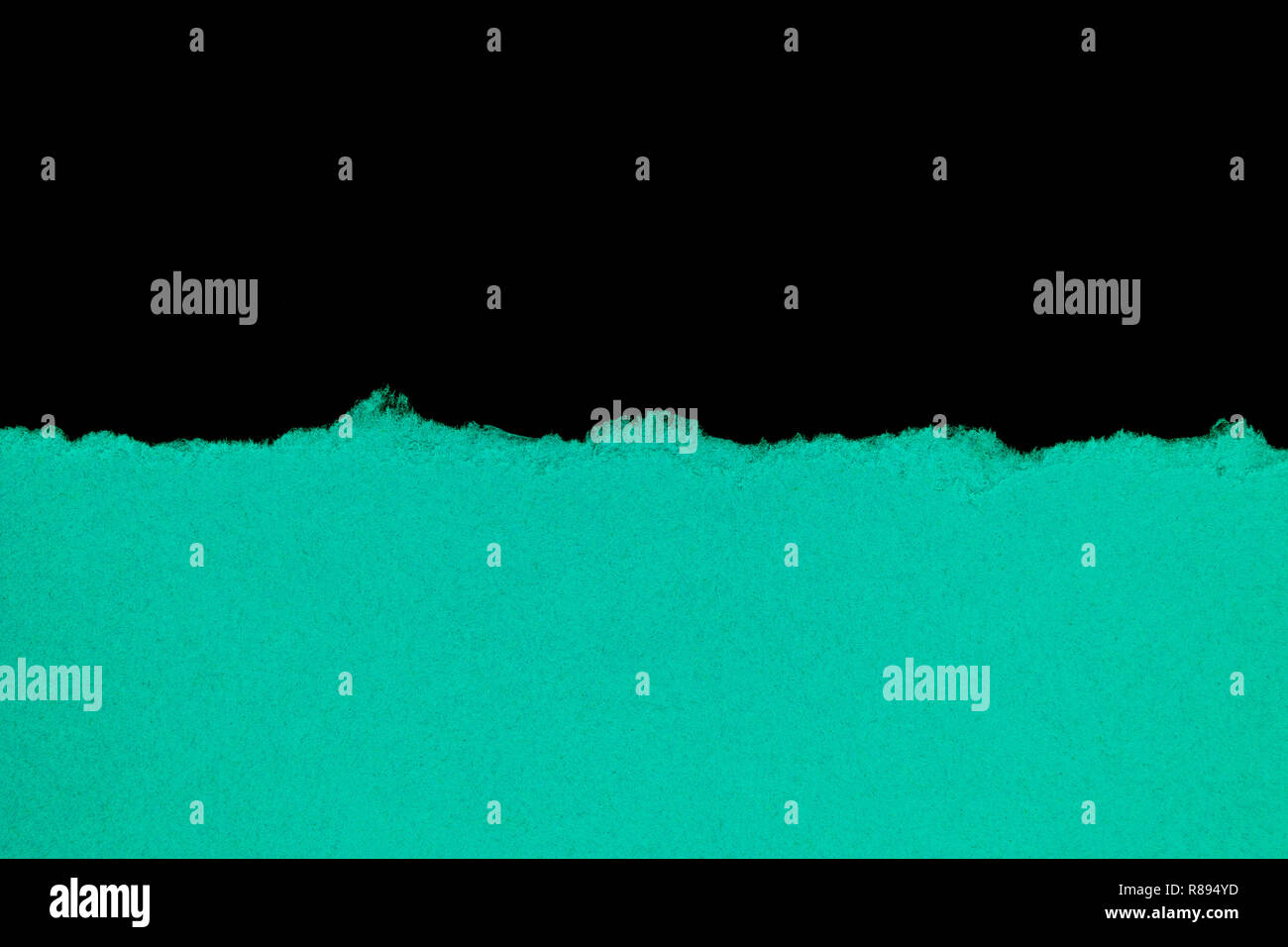 Light blue ripped paper isolated on black background with copy space ...