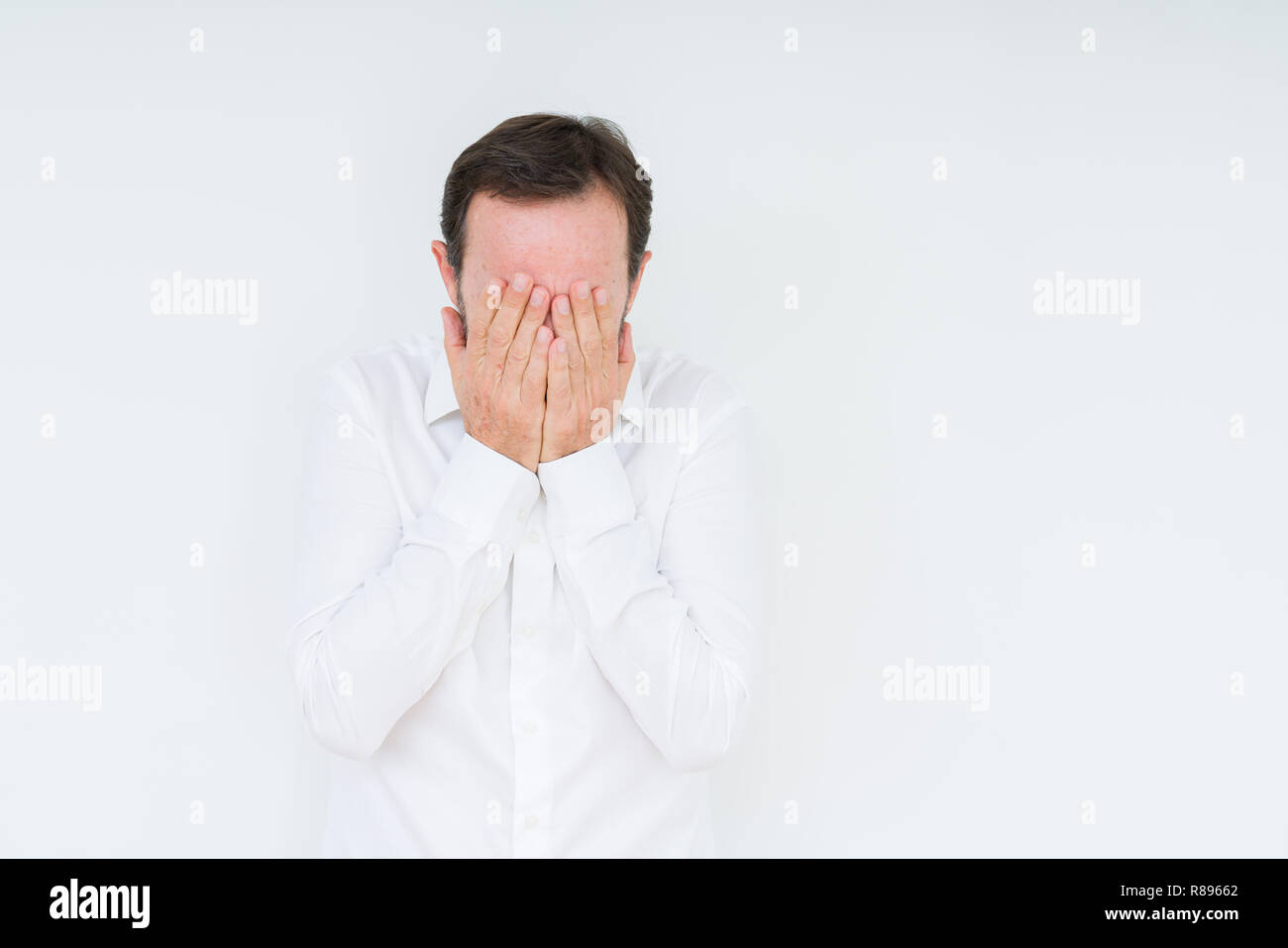 Elegant senior man over isolated background with sad expression ...