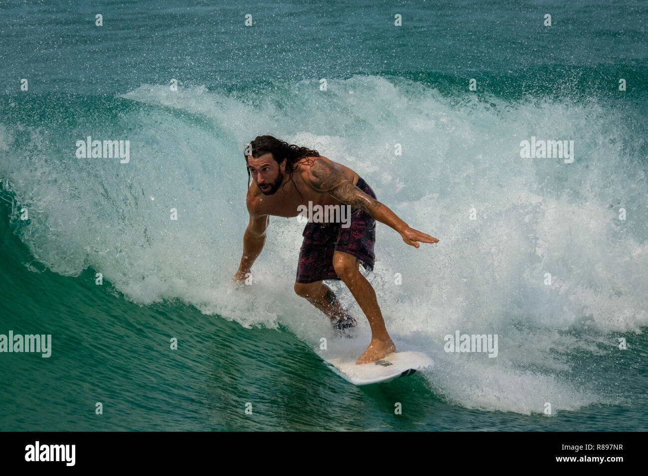 Surfers near the Sand Pumping Jetty, The Spit Stock Photo - Alamy