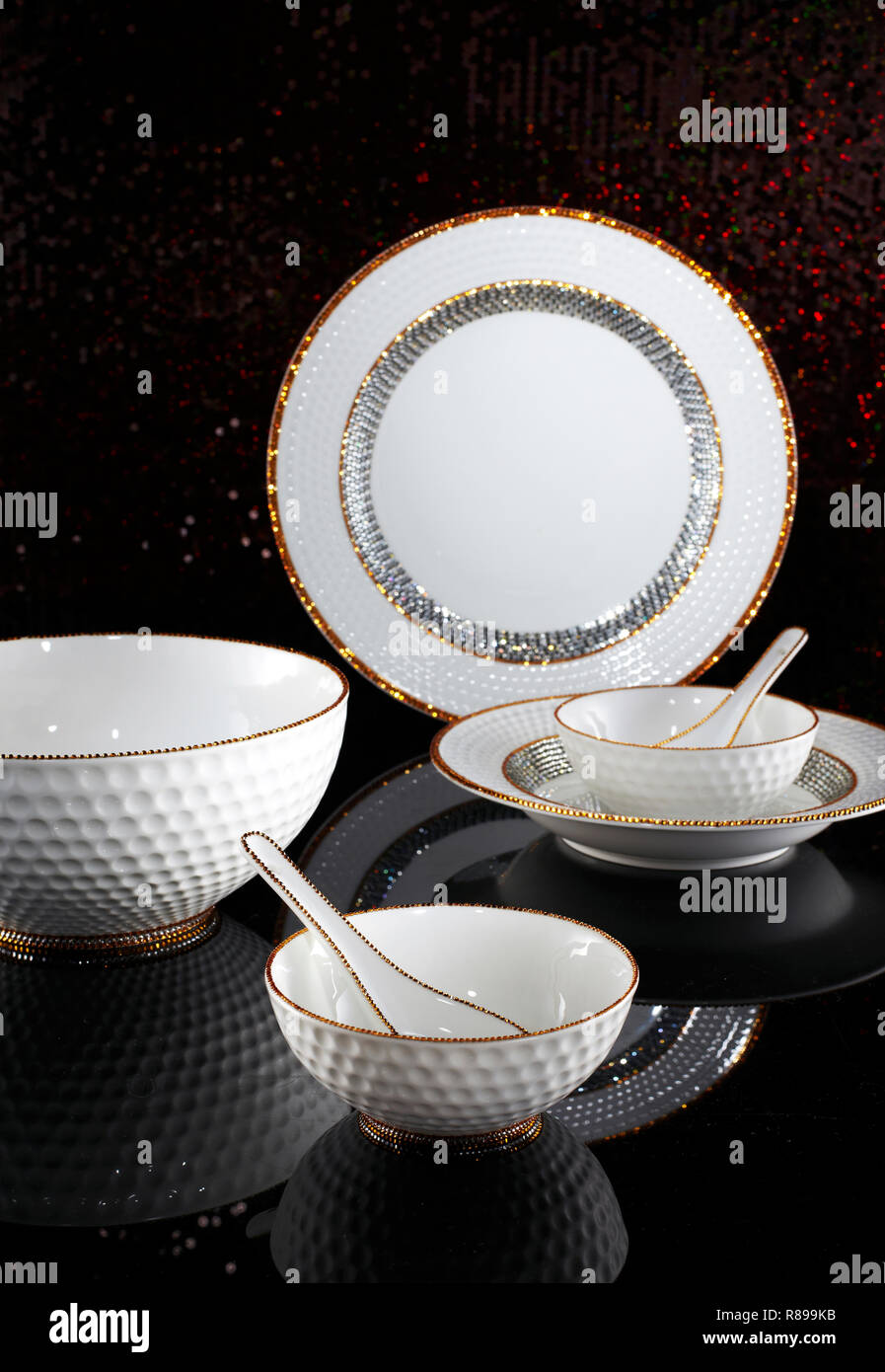 Fine tableware combination on dark background Stock Photo - Alamy