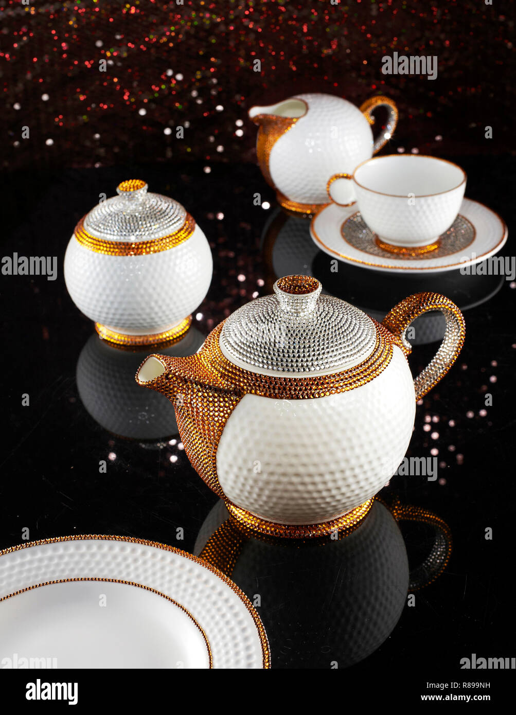 Fine tableware combination on dark background Stock Photo - Alamy