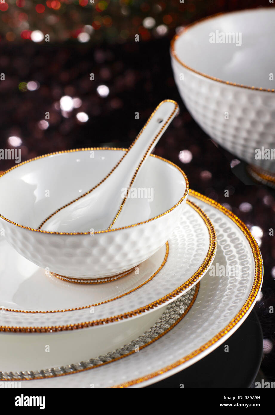 Fine tableware combination on dark background Stock Photo - Alamy