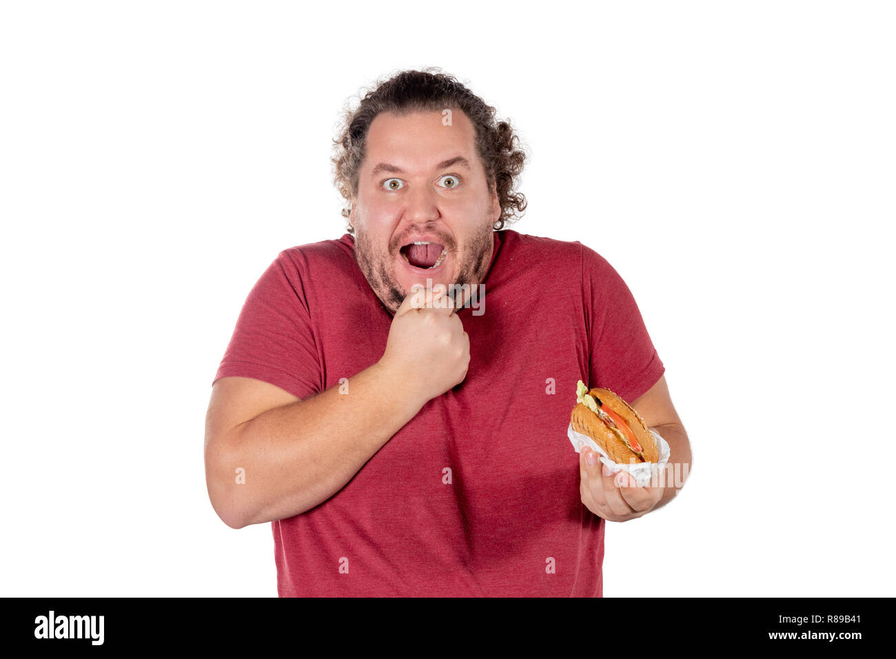 Funny fat man eating hamburger. Fast food, unhealty eat Stock Photo - Alamy