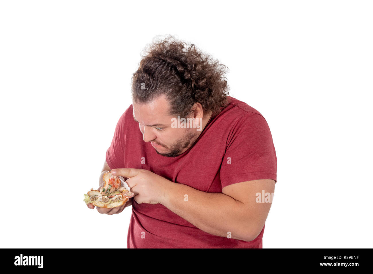 Funny fat man eating hamburger. Fast food, unhealty eat Stock Photo - Alamy