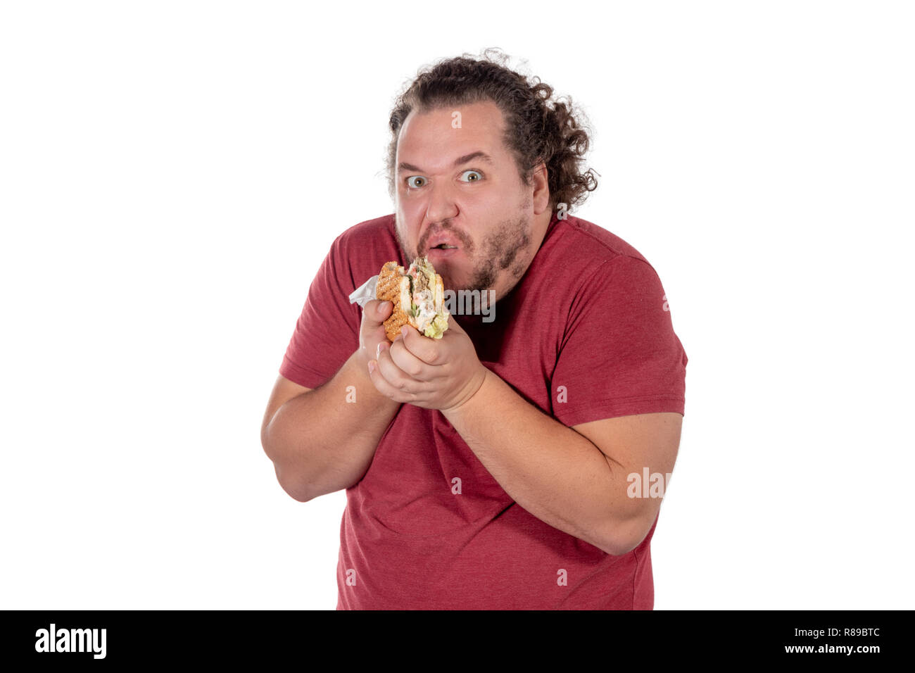 Funny fat man eating hamburger. Fast food, unhealty eat Stock Photo - Alamy