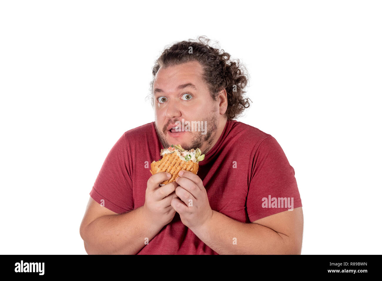 Funny fat man eating hamburger. Fast food, unhealty eat Stock Photo - Alamy
